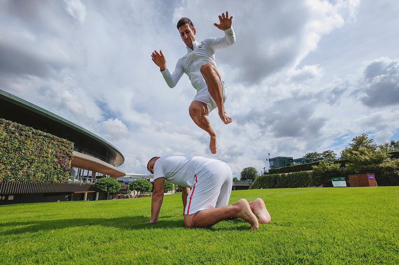 Novak Djokovic (SRB) on The Hill jumping over his physiotherapist ...