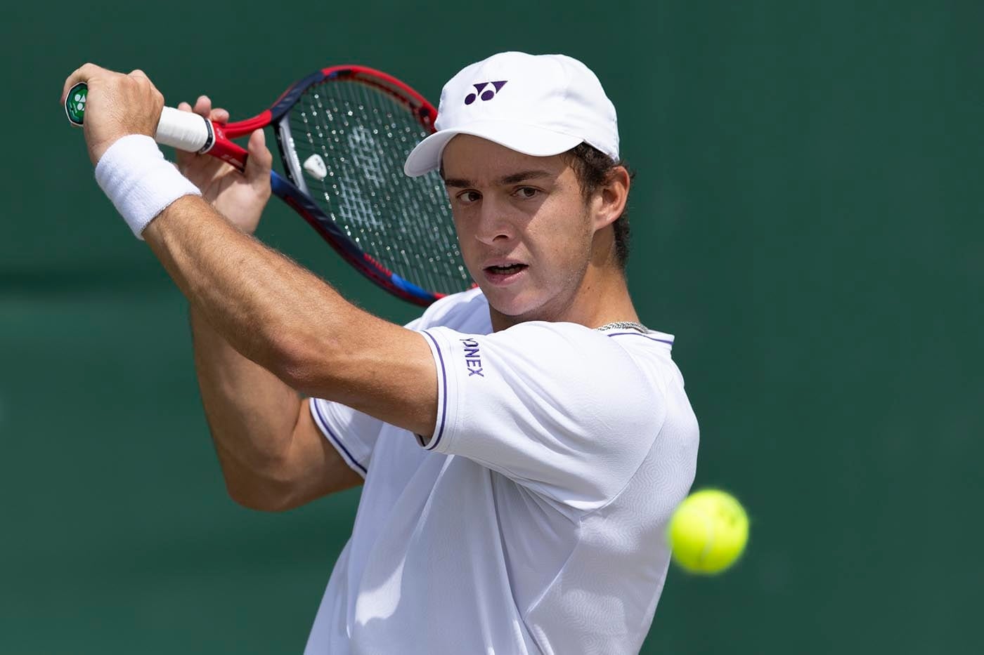 Kaylan Bigun plays a backhand against Amir Omarkhanov - The ...