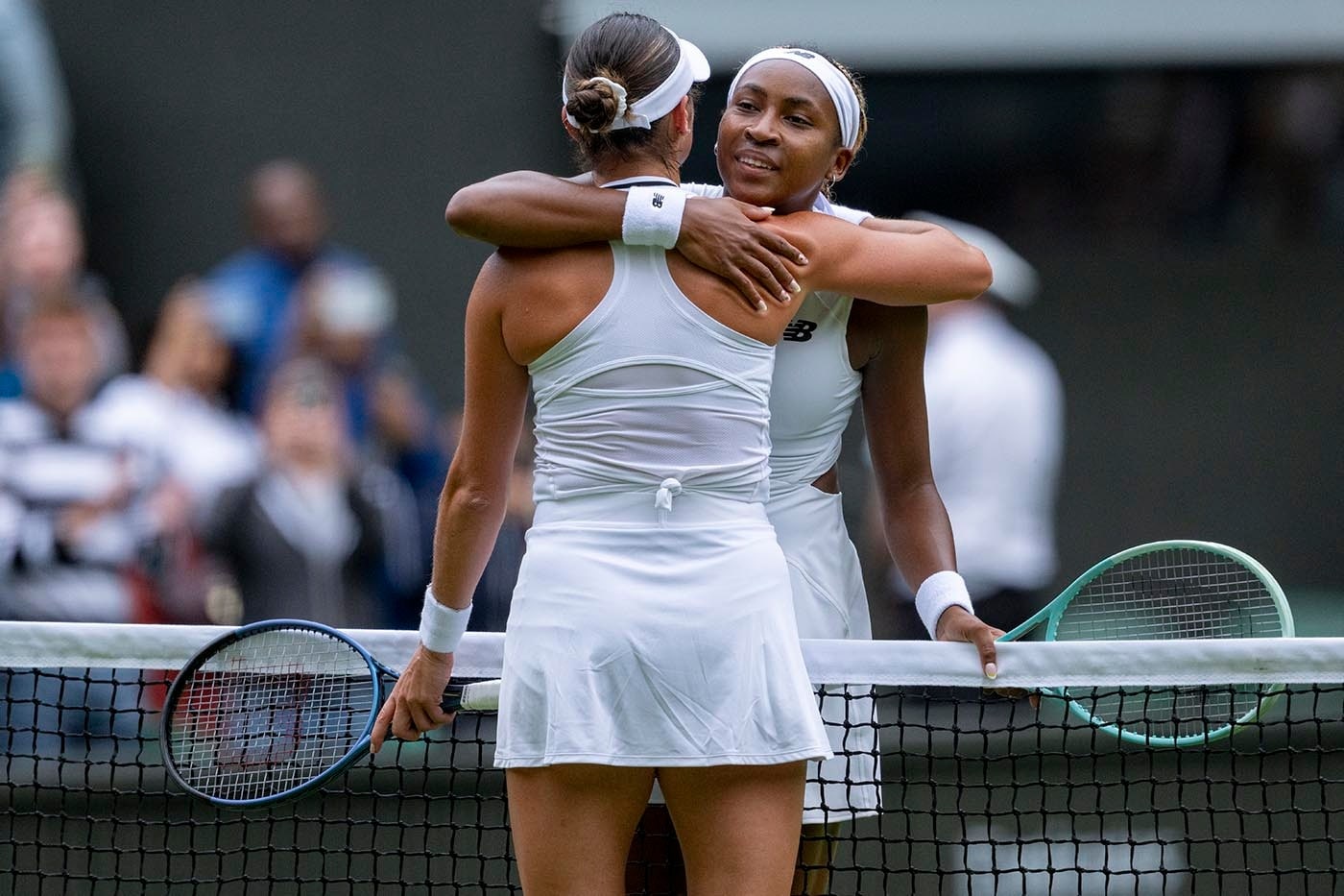 Coco Gauff (USA) hugs Caroline Dolehide (USA) at the net following ...